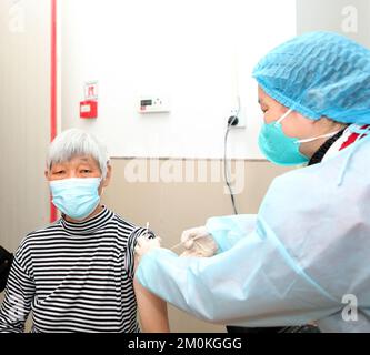 CHONGQING, CHINA - DECEMBER 19, 2022 - A medical worker inoculates a ...