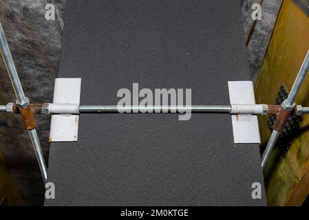 Steel fixing of the ceramic chimney to the trusses inside the attic ...