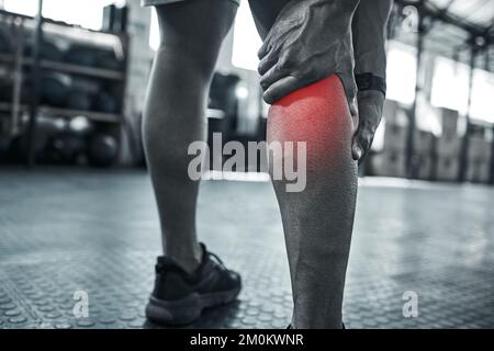 Cgi athlete in pain. Hands of athlete touching his ankle in pain. Bodybuilder in discomfort from ...