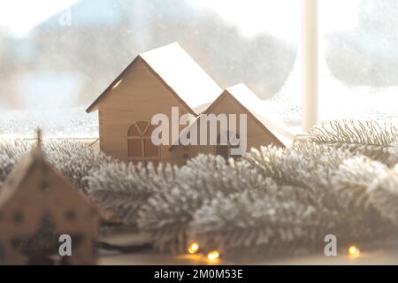 two decorative houses stand on the windowsill, New Year's decor Stock ...