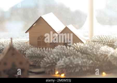 two decorative houses stand on the windowsill, New Year's decor Stock ...