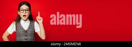 amazed child pointing finger on headphones at blackboard, childhood ...