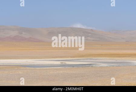 Extraordinary reddish desert landscape along the Pacific coast of Peru ...
