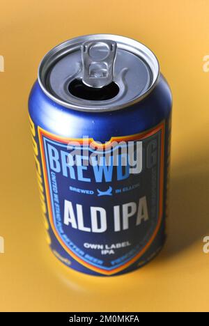An empty can of Brewdog ALD IPS beer isolated against a yellow ...