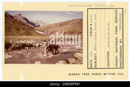 Hikers fording Grizzly Creek. Alaska Task Force Photographs Stock Photo ...