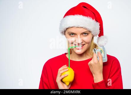 Girl with lemon and money. Lemon money concept. Girl santa hat drink ...