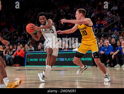 Iowa guard Payton Sandfort drives up court during an NCAA college ...