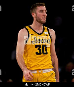 Iowa guard Connor McCaffery (30) passes the ball as he is defended by ...
