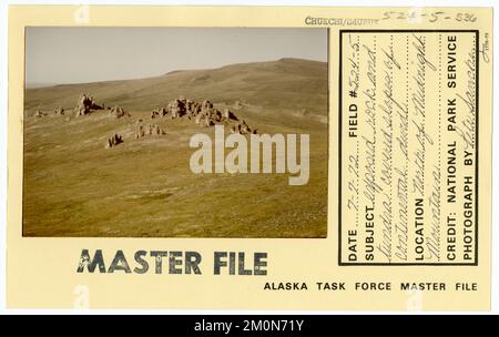 Exposed rock and tundra covered slopes of continental divide. Alaska ...