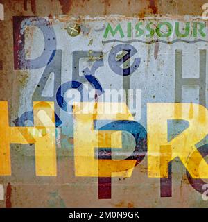 Enameled metal advertising boards or signs from a bygone era with ...