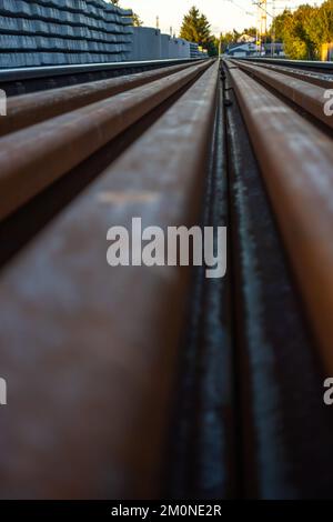 Expansion of railway lines. Train rails ready for laying and concrete ...
