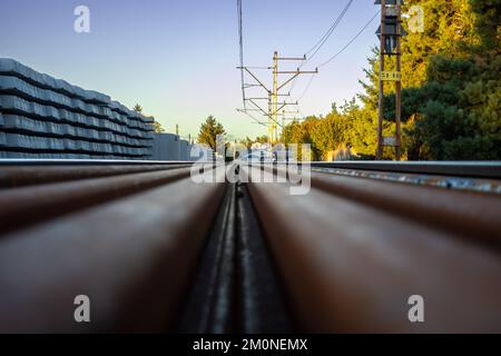 Expansion of railway lines. Train rails ready for laying and concrete ...