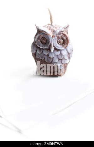 A candle in the shape of an owl. Holiday advent. Beautiful handmade ...