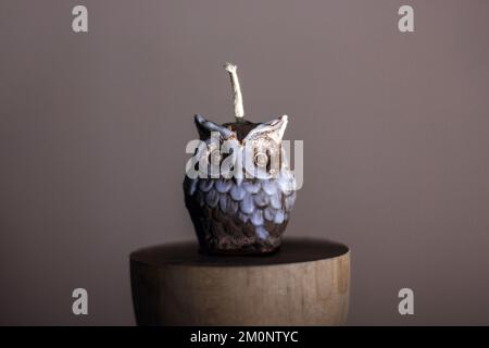 A candle in the shape of an owl. Holiday advent. Beautiful handmade ...