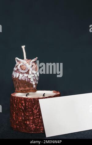 A candle in the shape of an owl. Holiday advent. Beautiful handmade ...