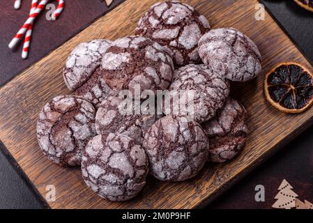Delicious fresh brownies with Christmas decorations on a dark concrete ...