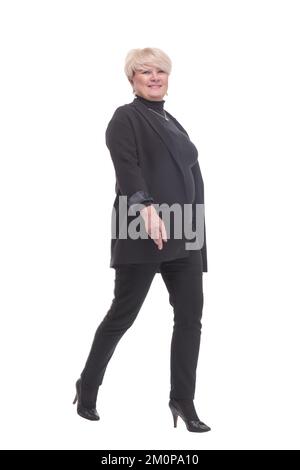 confident business woman striding forward. isolated on a white ...