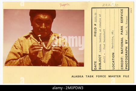Eskimo looking at remains of skull - Fred Bezezekoff. Alaska Task Force ...