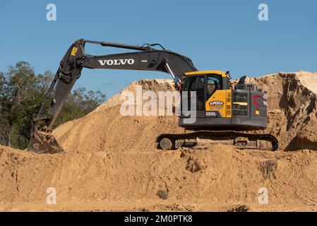 DeLand, Florida, USA. 2022. A crawler excavator shifting sand on a ...