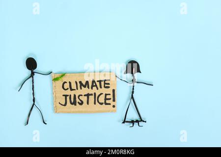 Climate justice concept. People stick figures protesting while holding ...