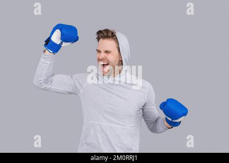 Boxer fighter making winning gesture in boxing gloves. Boxer man happy ...