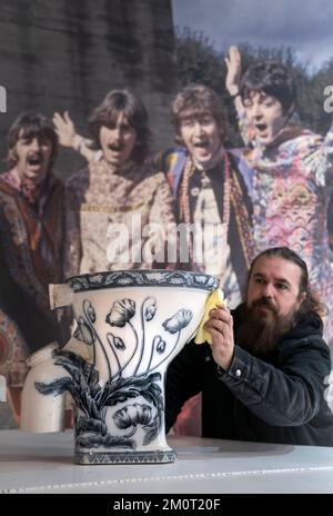 Roag Best gives a final polish to John Lennon's toilet from his ...