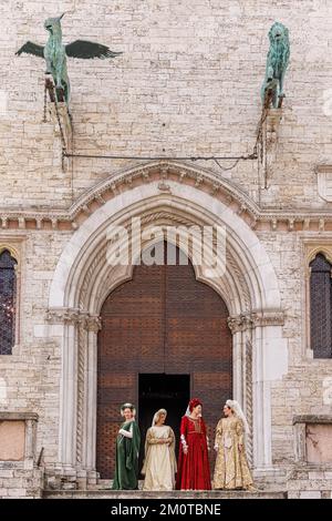Italy, Umbria, Perugia, women in period costume in front of the dei ...