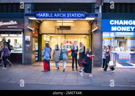 Marble Arch Underground Station with commuters and visitors outside in ...