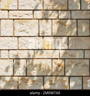Sturdy yellow and beige cut stone wall, good for backgrounds, seamless ...