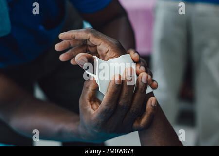 Therapist making assistive device for immobilize patient hand. Splint ...