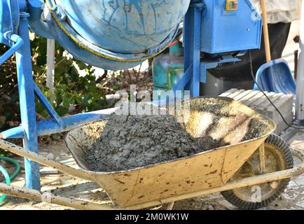 Detail of a hand-held concrete temperer during house construction Stock ...