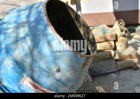 Detail of a hand-held concrete temperer during house construction Stock ...