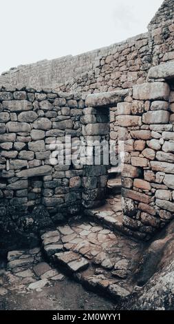 A vertical shot of historical pieces of architecture of Khami ruins ...