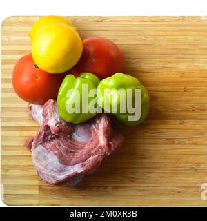 Clean red raw cow meat beef, and very fresh vegetables on bamboo ...