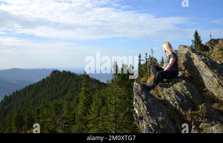 Woman on the top of mountain Grosser Osser ( Velky Ostry ) in the ...