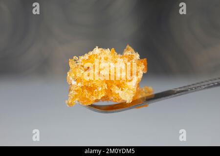 golden cannabis wax crystals, high thc crumble Stock Photo - Alamy