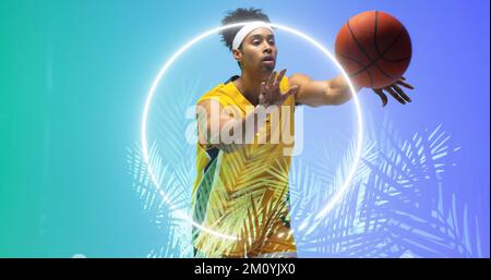 Composite of biracial basketball player throwing ball by illuminated ...