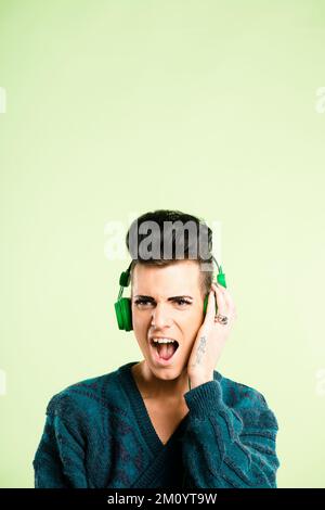 looking so trendy. Enjoying song playing in headphones. Karaoke and ...