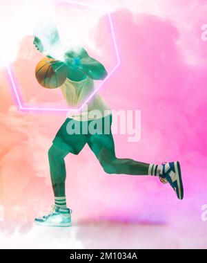 Side view of african american basketball player holding ball by ...