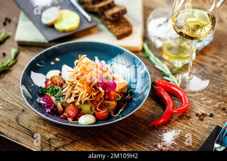 Warm salad with chicken. Almond potato, mini romaine lettuce, carrot ...