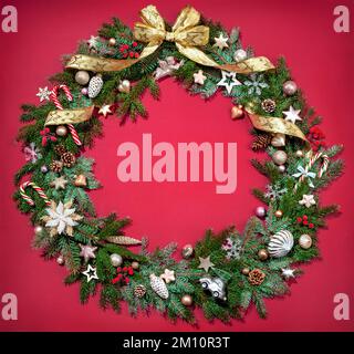 Bright Christmas wreath made of fir branches, balls and decor isolated ...