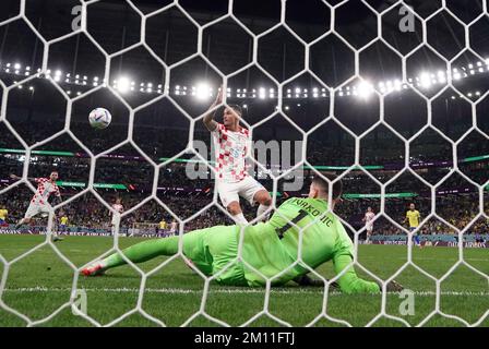 Croatia goalkeeper Dominik Livakovic (1) saves the first penalty kick ...