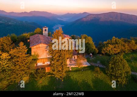 Sunset on the small church of Santa Maria del Giogo and Val Trompia ...