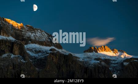 Moon over the Sella Massif Stock Photo - Alamy