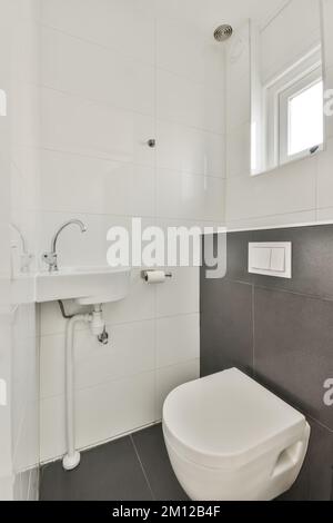 Toilet & Window In Very Small Room Stock Photo - Alamy