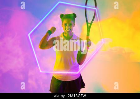 Excited african american female tennis holding racket and jumping by ...