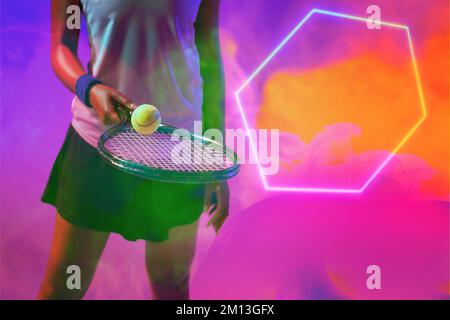 Midsection of african american female tennis player with racket by ...
