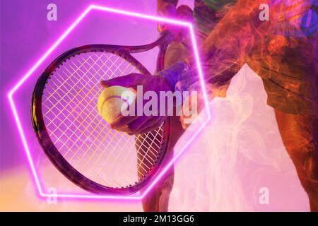 Midsection of african american male tennis player holding racket by ...