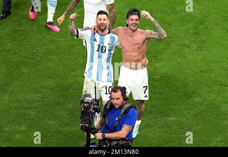 Argentina's Lionel Messi (left) and Rodrigo Paul De celebrate victory ...