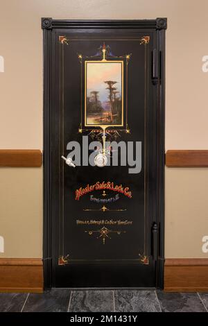 Storage door with lock in basement of condo apartment building. Metal ...